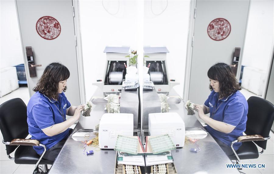 Mobile payment facilitates work for cashiers- China.org.cn