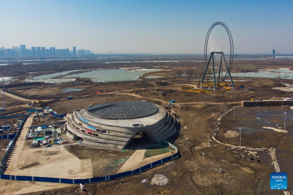 Construction workers busy building projects in spring time in Harbin ...