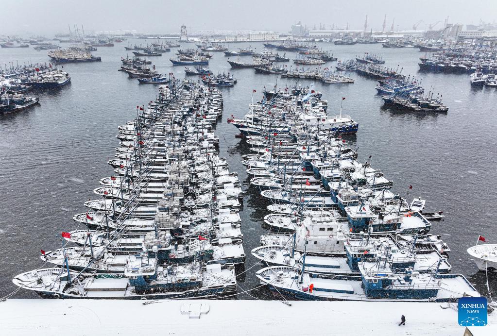 Fishing boats berth in snow at Shidao fishing port, E China's Shandong ...